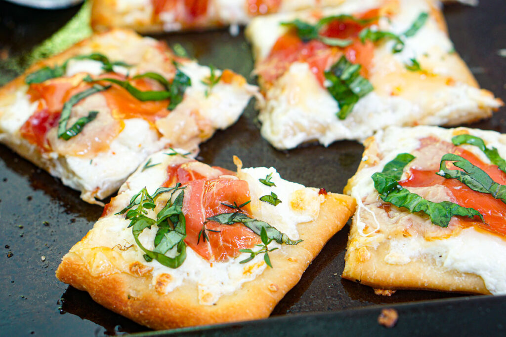 Easy Prosciutto Flatbread Appetizer Recipe | using 3 cheeses!
